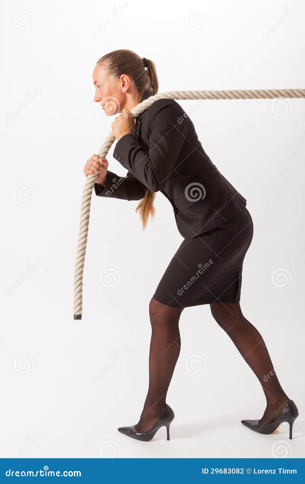 A Woman is Pulling at a Thick Rope Stock Photo - Image of woman, firm ...