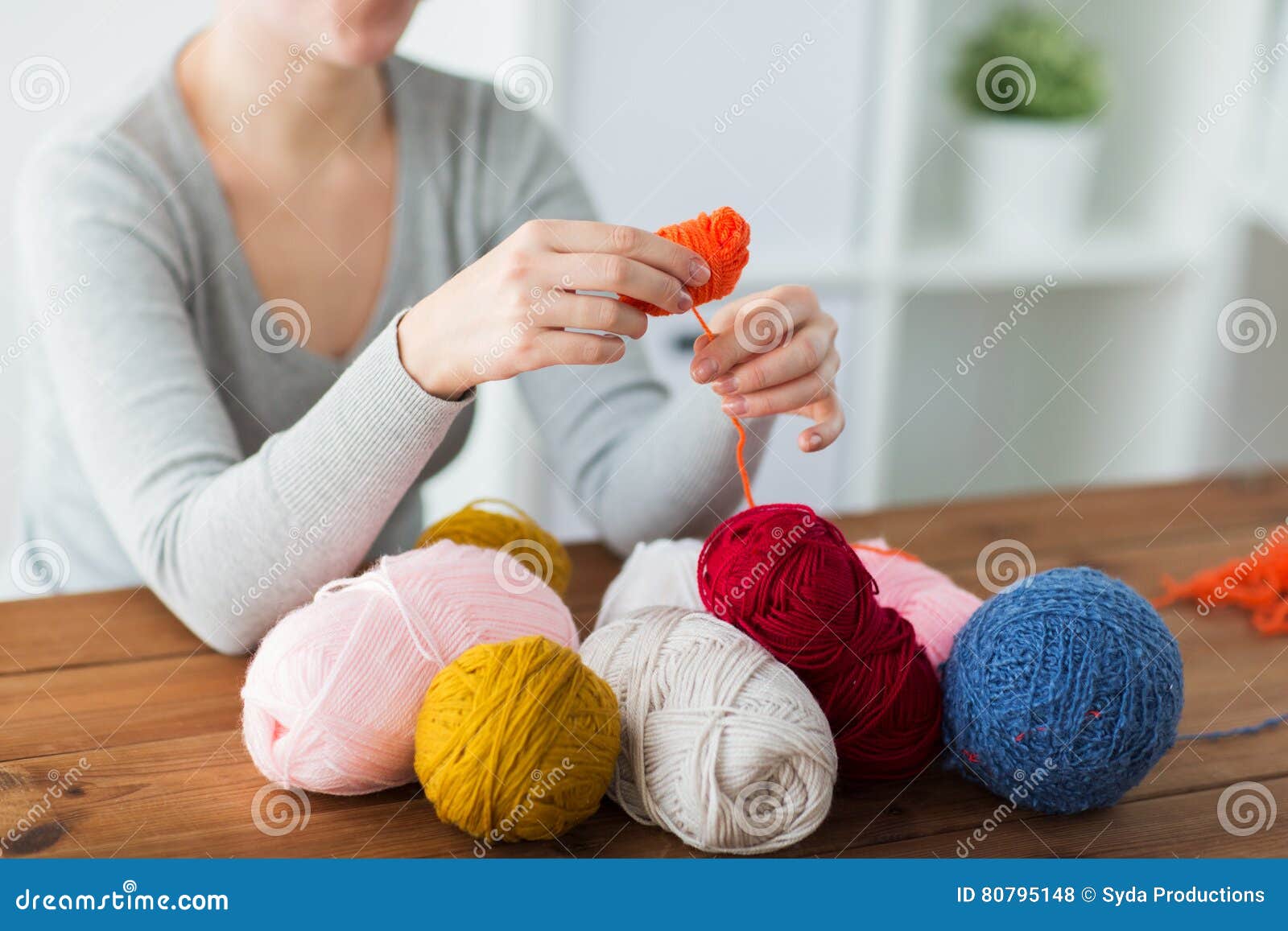 Woman Pulling Yarn Up into Ball Stock Photo - Image of knitter, knit ...