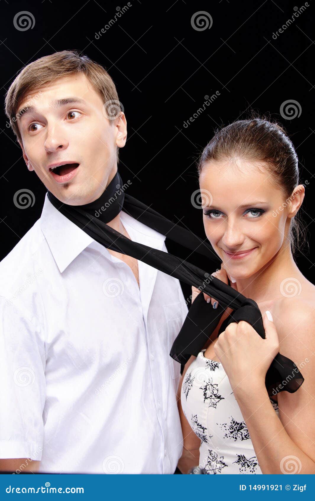 Woman pulls man for scarf stock image. Image of female - 14991921