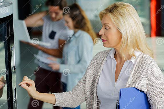 Woman Pushing Button on Vending Machine Stock Photo - Image of ...