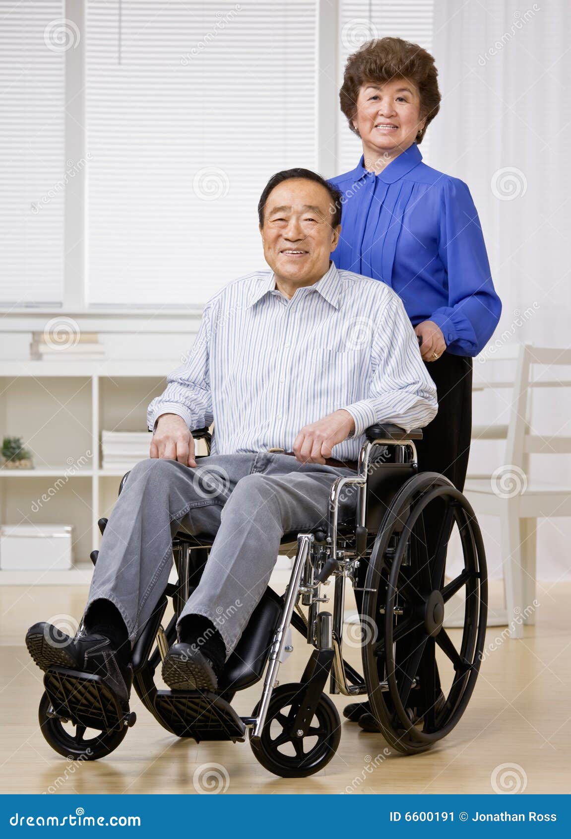 Woman Pushing Man in Wheel Chair Stock Image - Image of life, person ...
