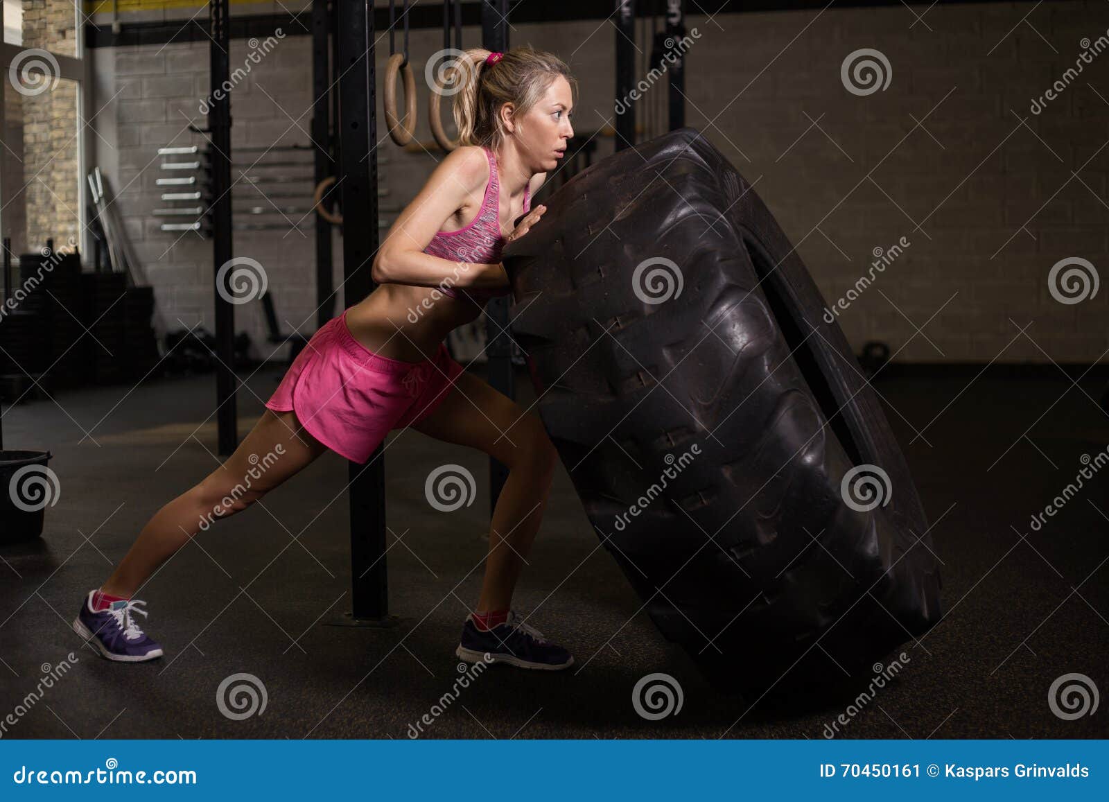 Woman Pushing Tire in Workout Gym Stock Image - Image of indoors ...