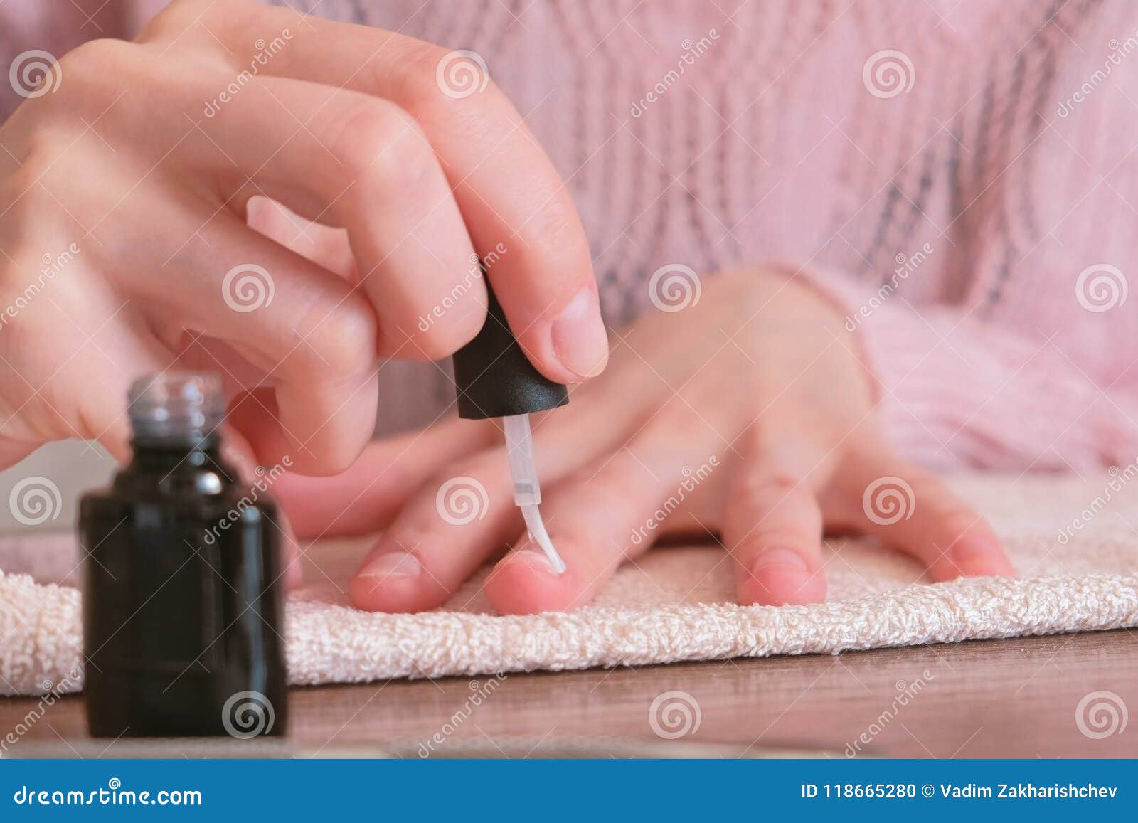 Woman Puts Primer on Her Nails before Putting Shellac. Close-up Hands ...