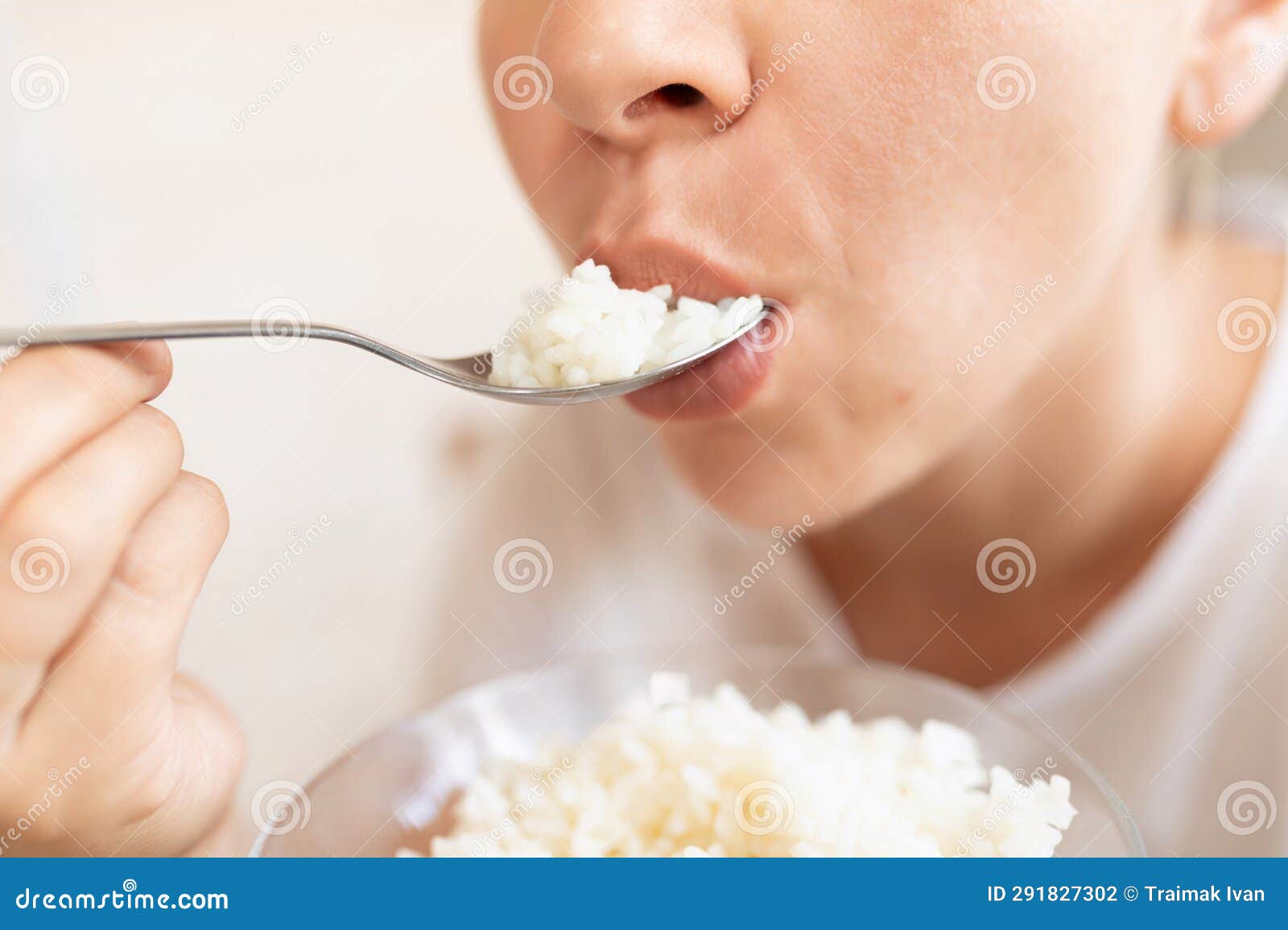 Woman Puts a Spoon of Rice in Her Mouth Stock Photo - Image of cereal ...