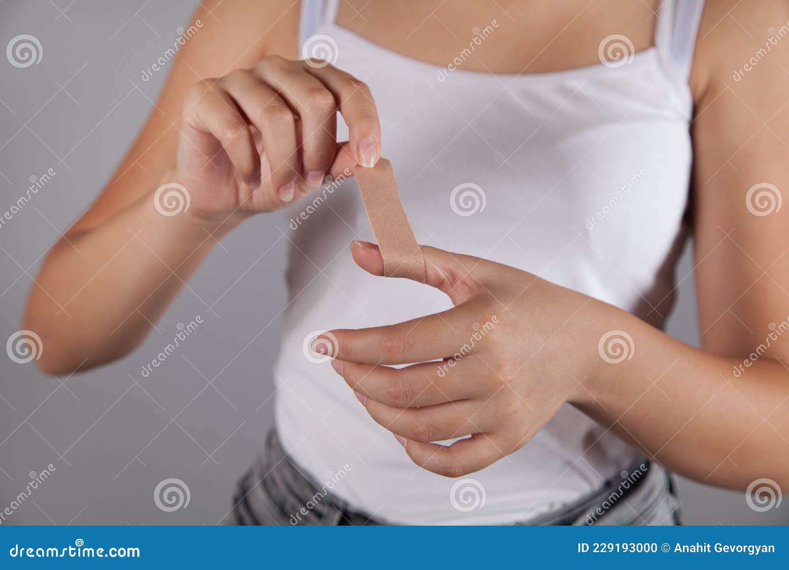 Woman Putting Adhesive Bandage on Finger Stock Photo - Image of patient ...