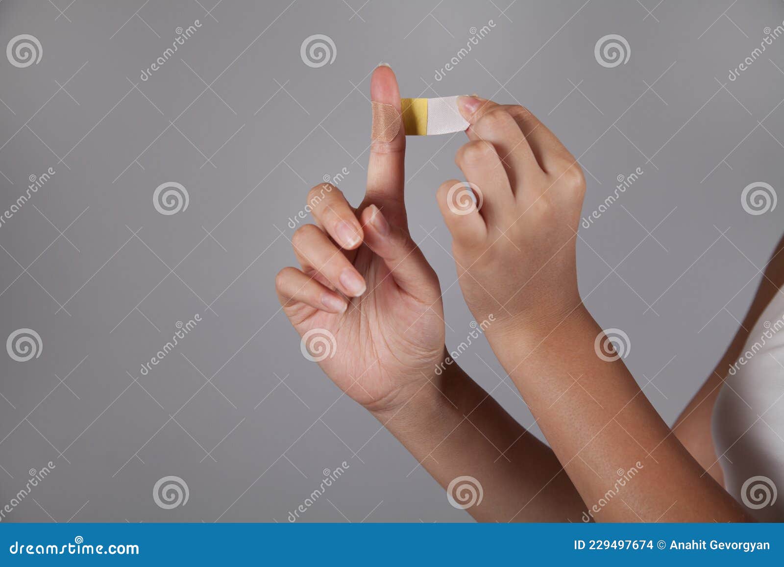 Woman Putting Adhesive Bandage on Finger Stock Photo - Image of wrap ...