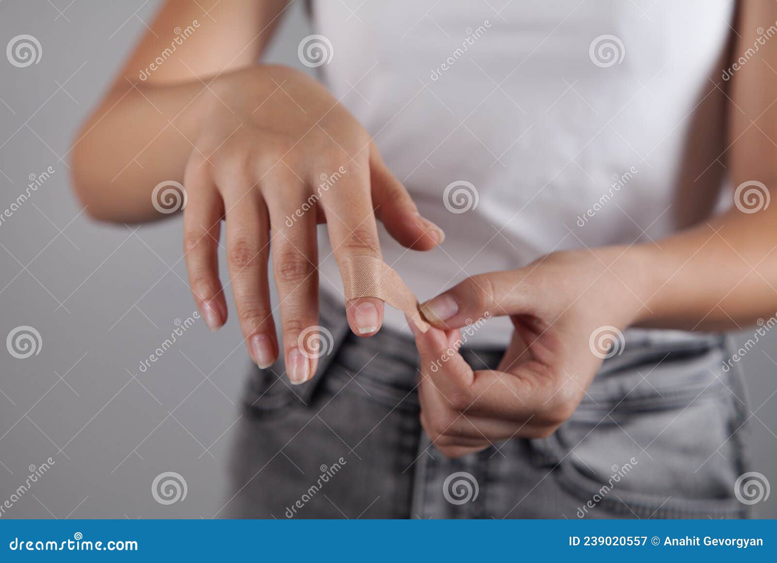 Woman Putting Adhesive Bandage on Finger Stock Image - Image of ...