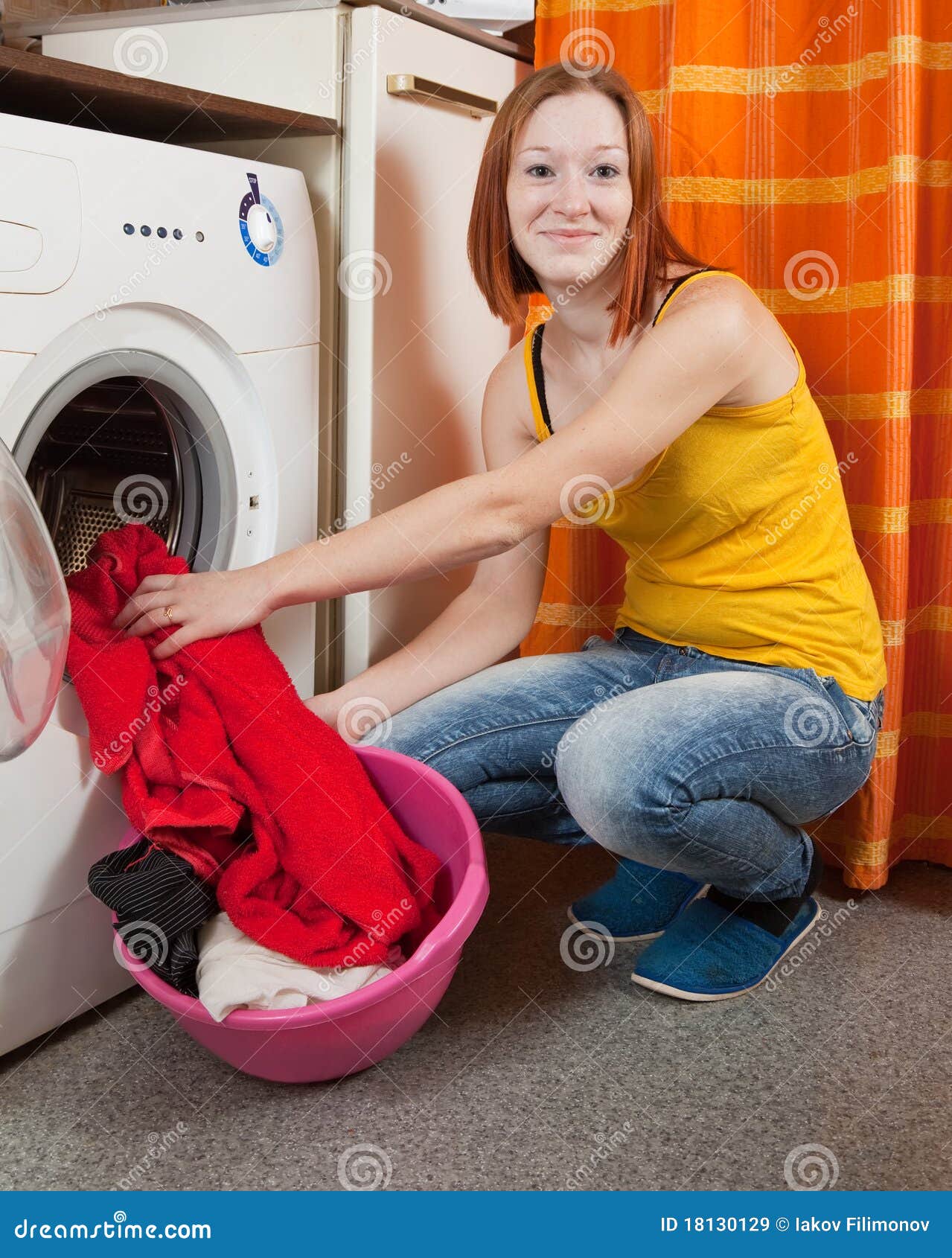 Woman Putting Clothes into Washing Machine Stock Image - Image of ...