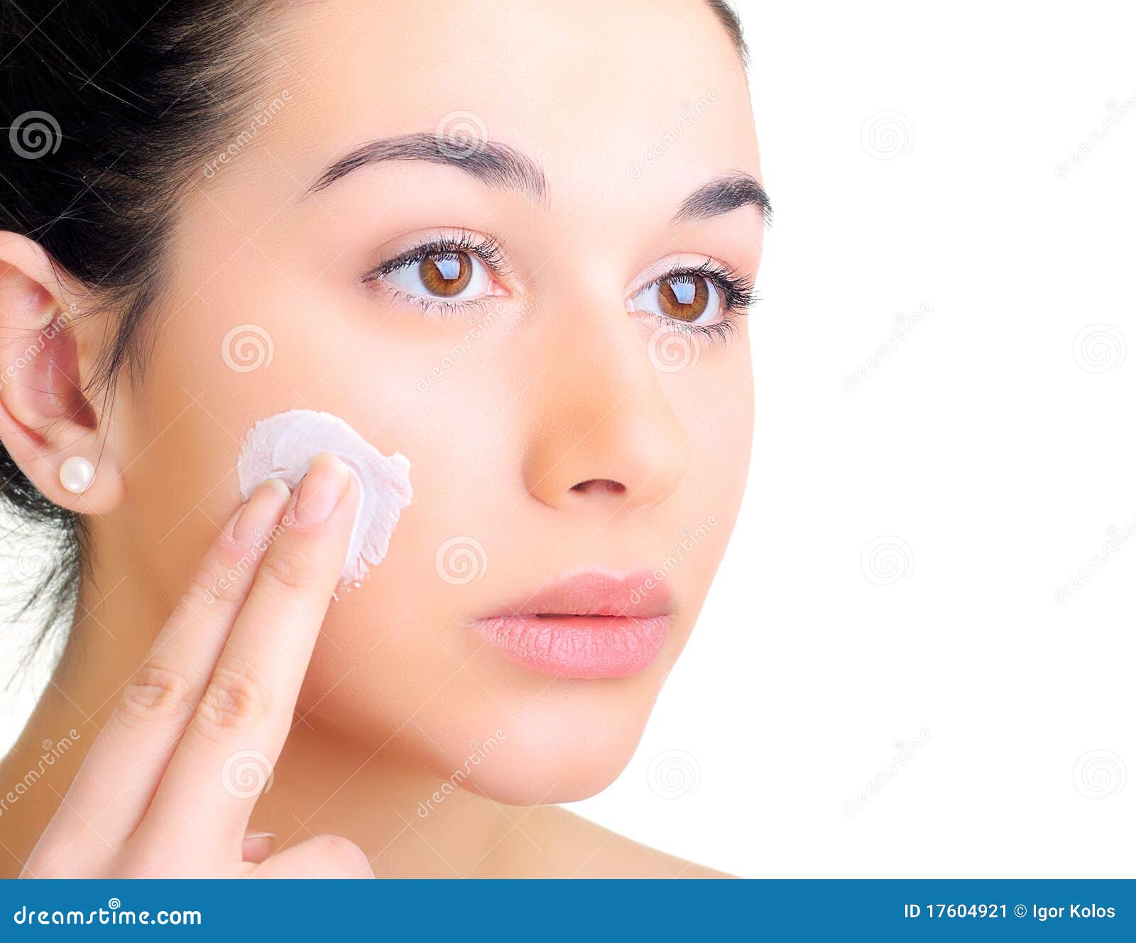 Woman putting cream stock image. Image of isolated, model - 17604921