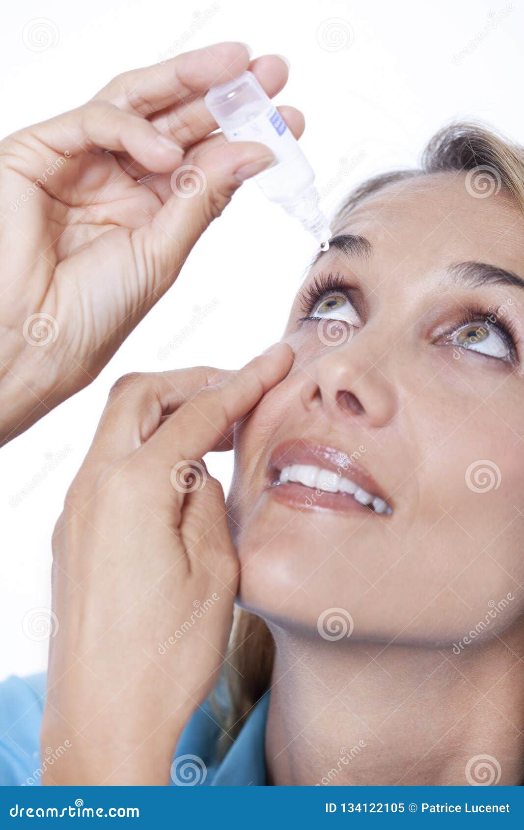 Woman putting on eye drops stock image. Image of suffering - 134122105