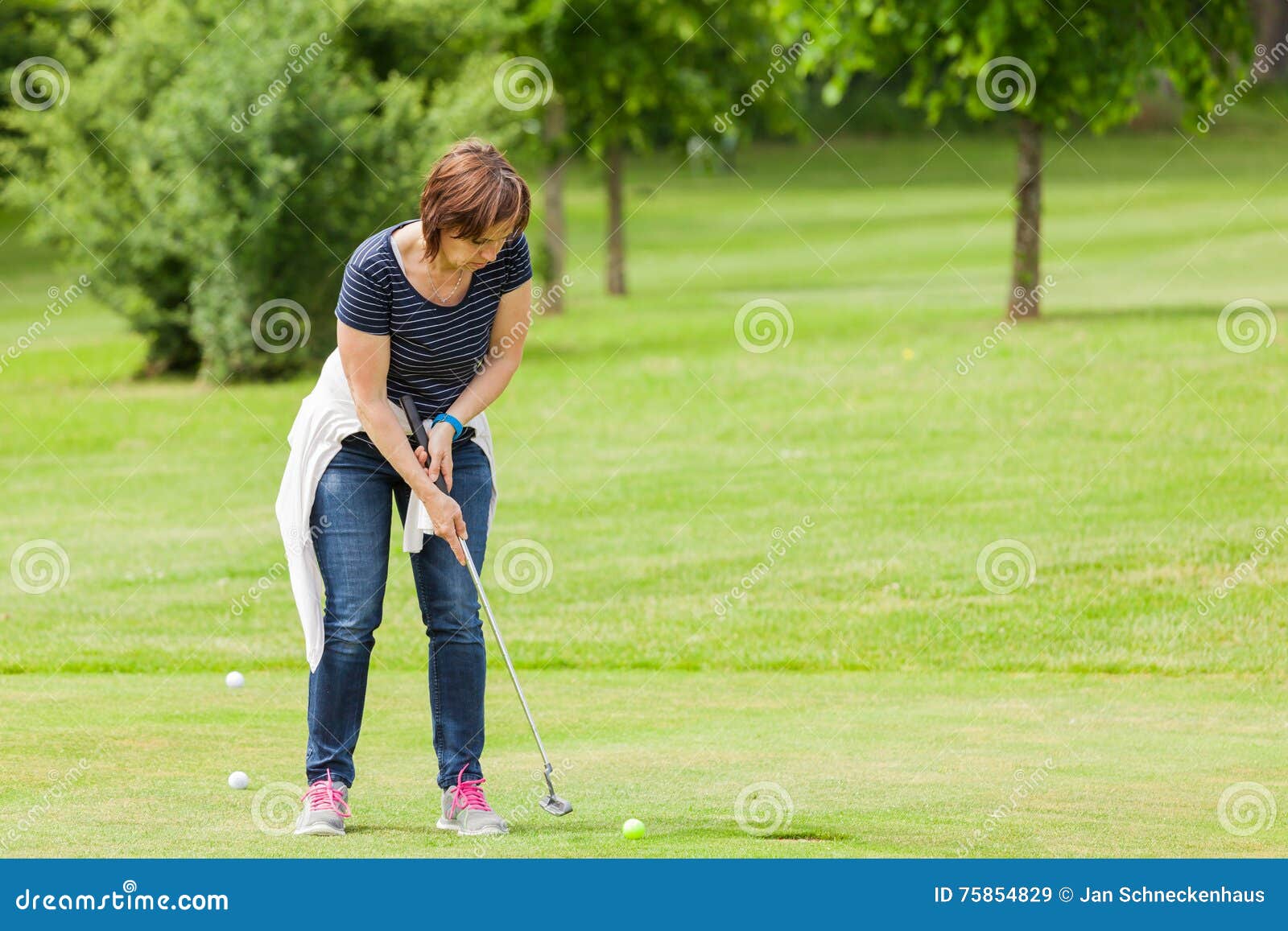 Woman at Putting on the Golf Course Stock Image - Image of golf ...