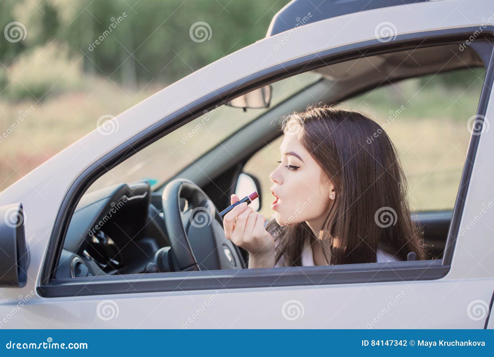 Woman Putting Lipstick in the Car Stock Photo - Image of female, girl ...