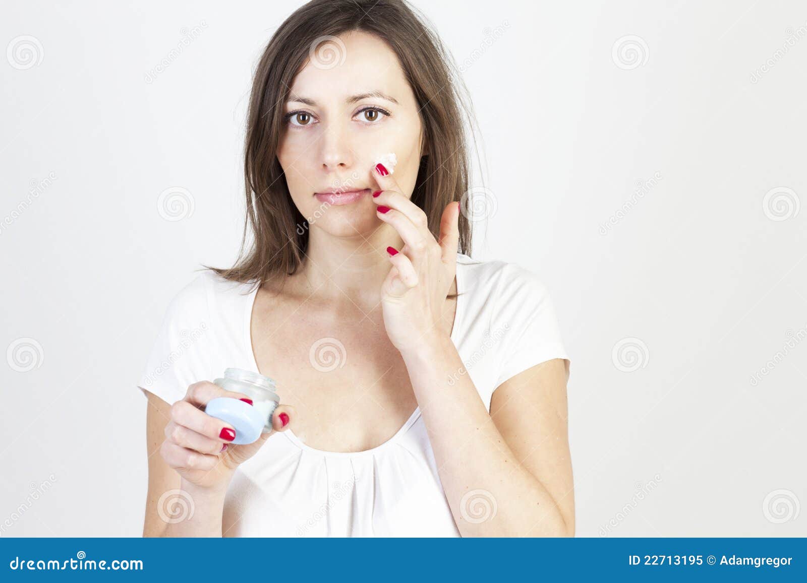 Woman putting lotion on stock image. Image of apply, protective - 22713195