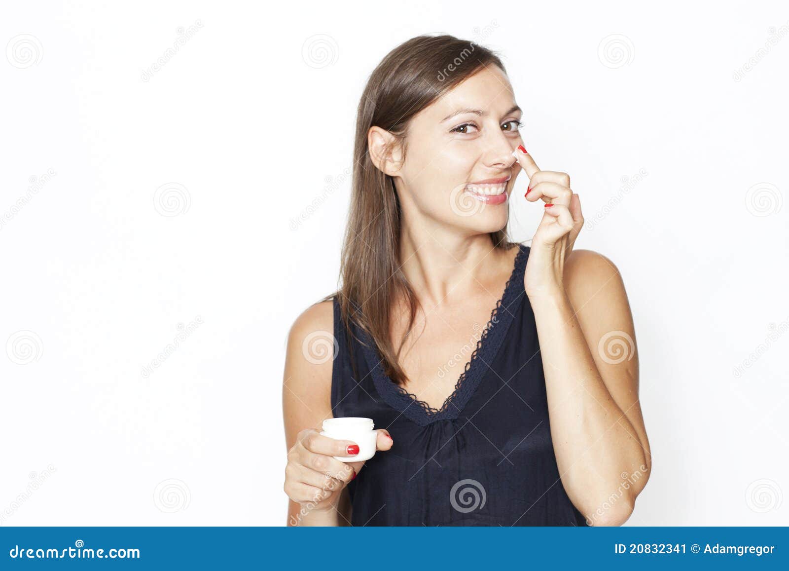 Woman Putting Lotion on Her Face Stock Image - Image of lotion ...