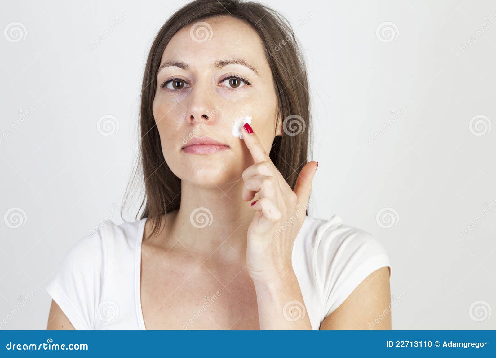 Woman Putting Lotion on Her Face Stock Photo - Image of protection ...