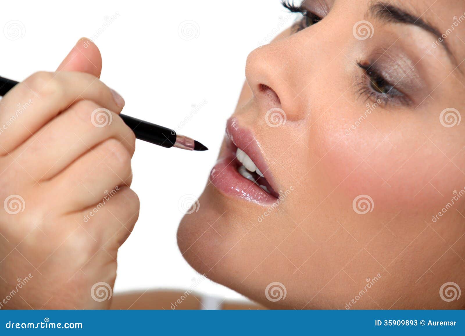 Woman putting make-up on. stock image. Image of model - 35909893