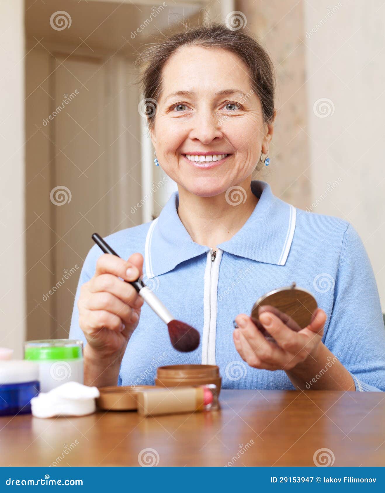 Woman Putting Make Up on Her Face Stock Image - Image of application ...