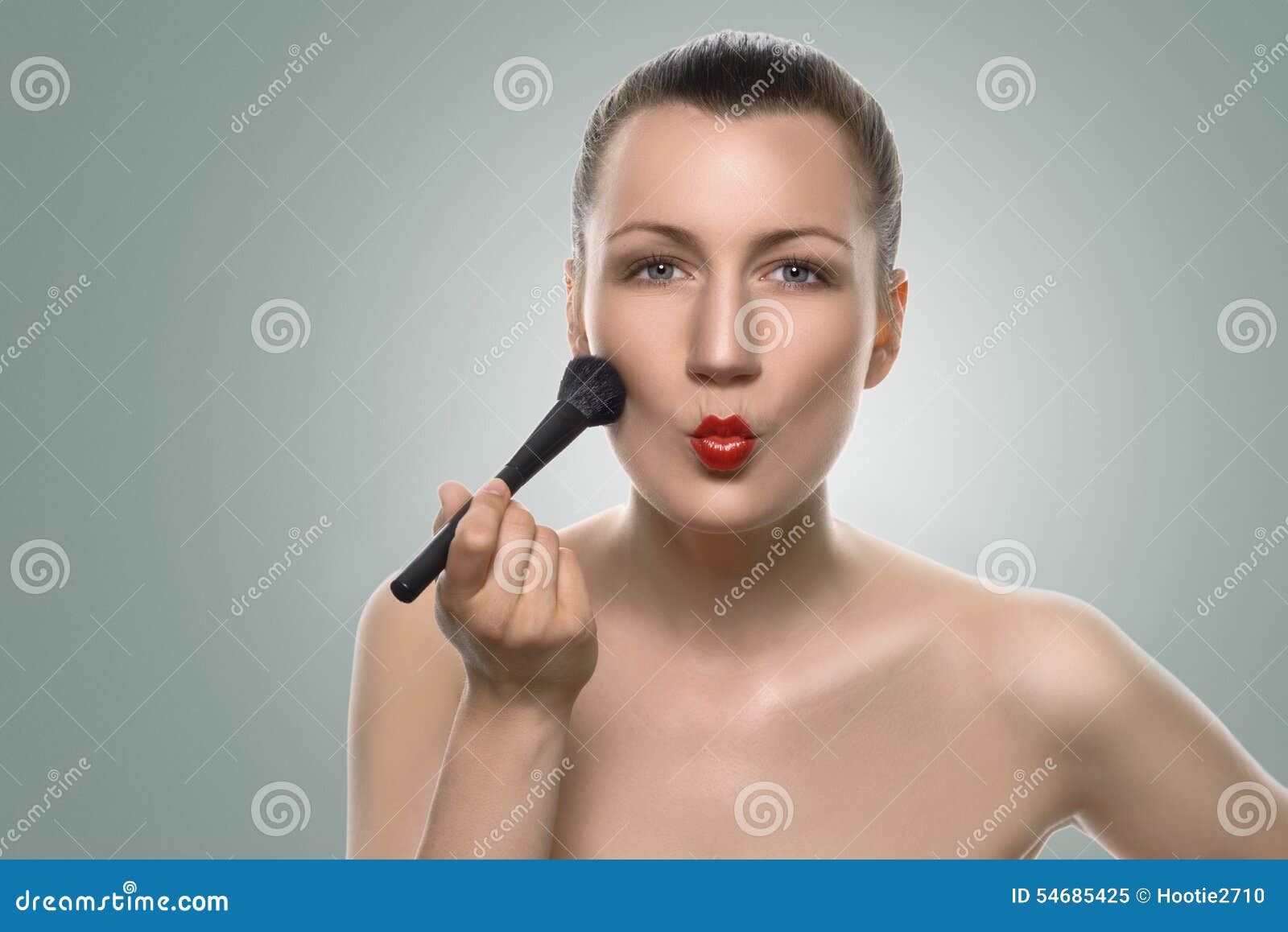 Woman Putting Makeup on Face with Pouting Lips Stock Image - Image of ...