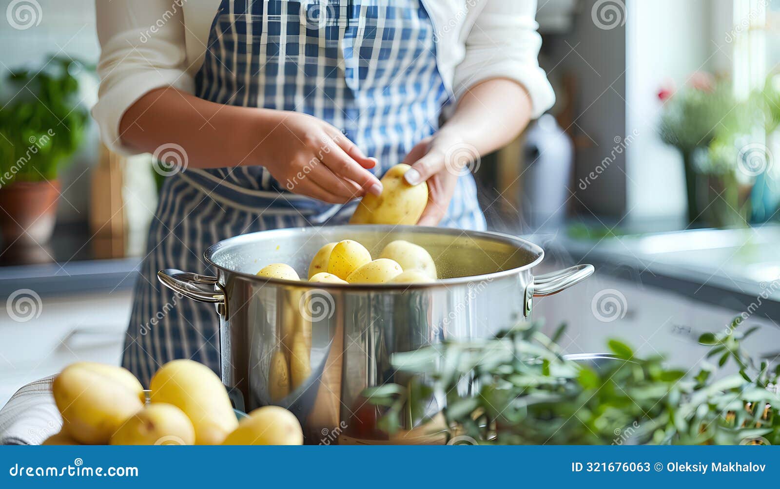 Woman Putting Peeled Potato in Pot at Table in Kitchen Stock ...