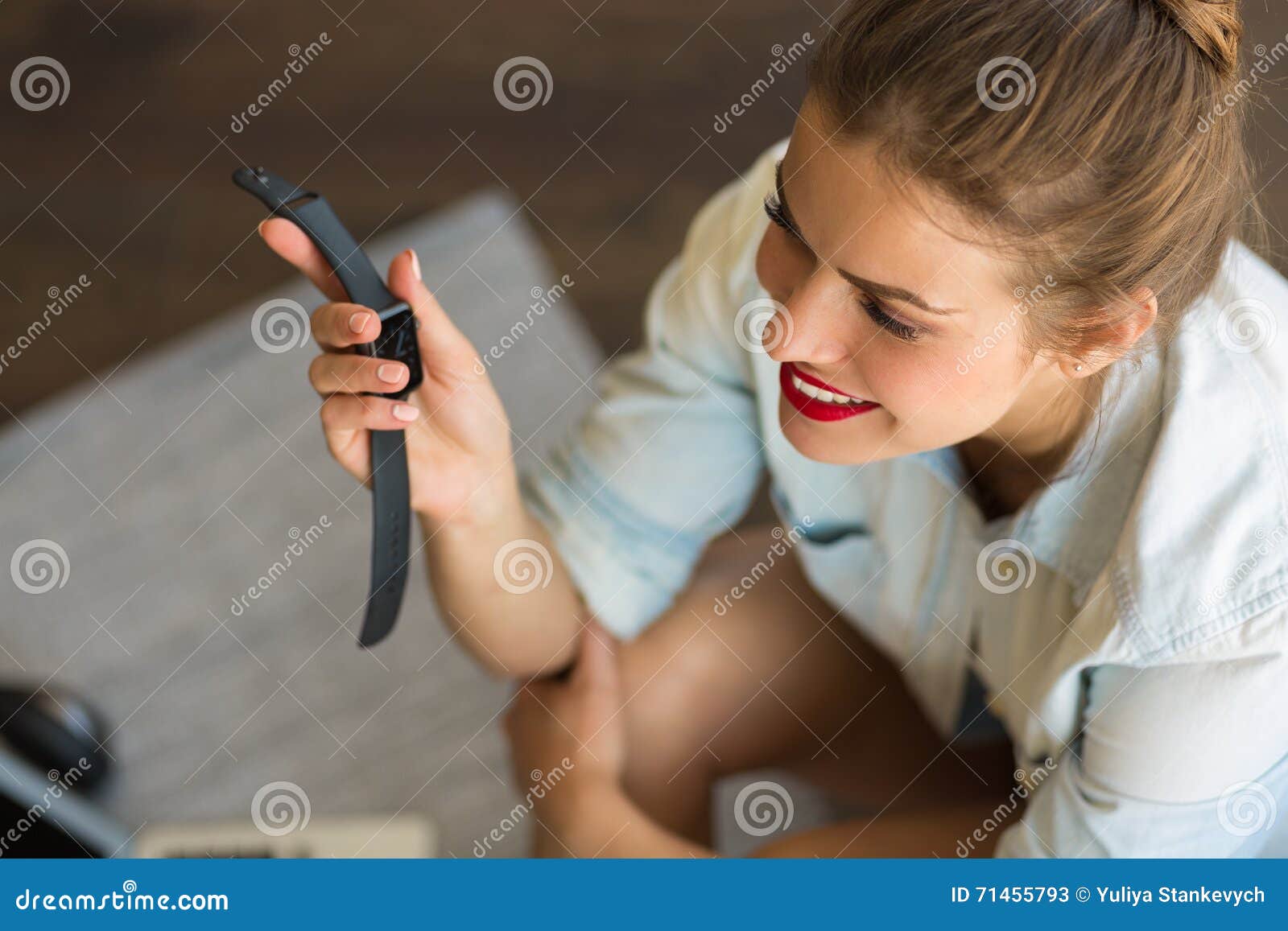 Woman Putting on a Smartwatch Stock Image - Image of indoor, smartwatch ...