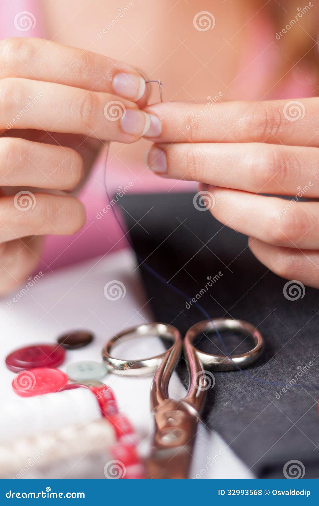 Woman Putting a Thread into the Needle Eye Stock Photo - Image of woman ...