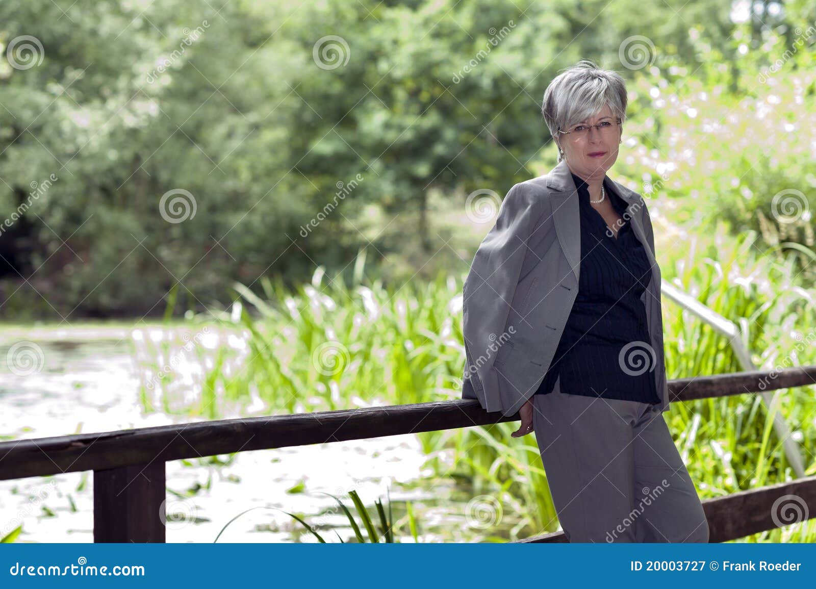 Woman at railing stock image. Image of lean, stand, reeds - 20003727