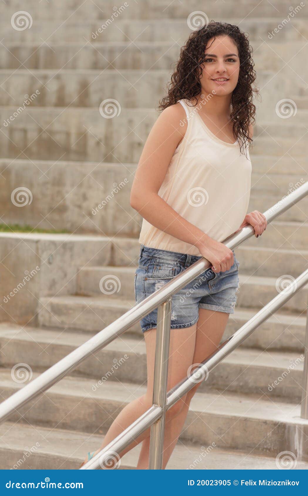 Woman by the railing stock image. Image of young, casual - 20023905