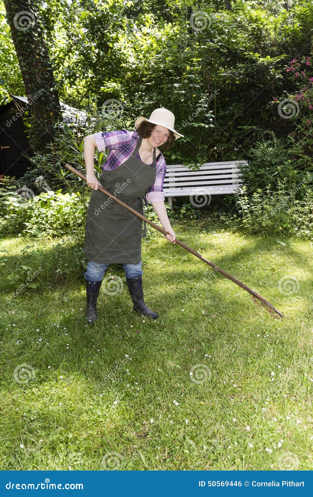 Woman with rake stock photo. Image of nature, gumboots - 50569446