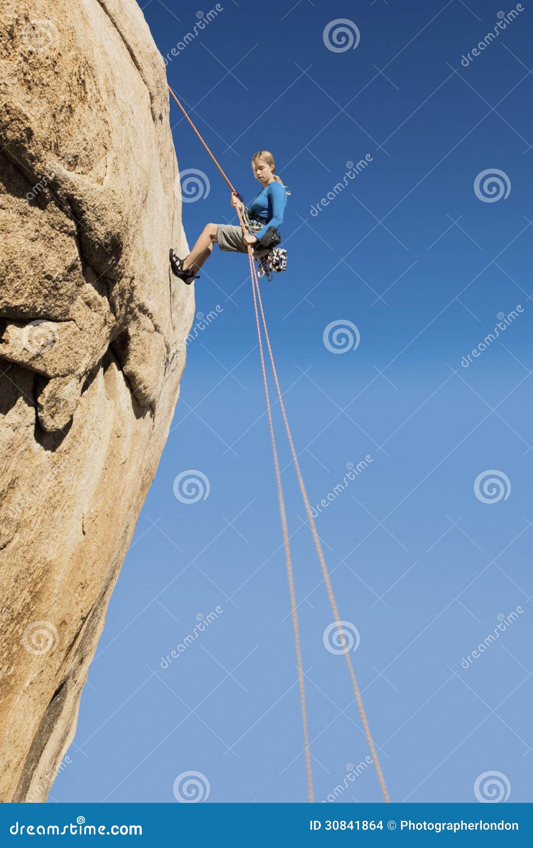 Woman Rappelling from Cliff Stock Photo - Image of cliff, lifestyle ...
