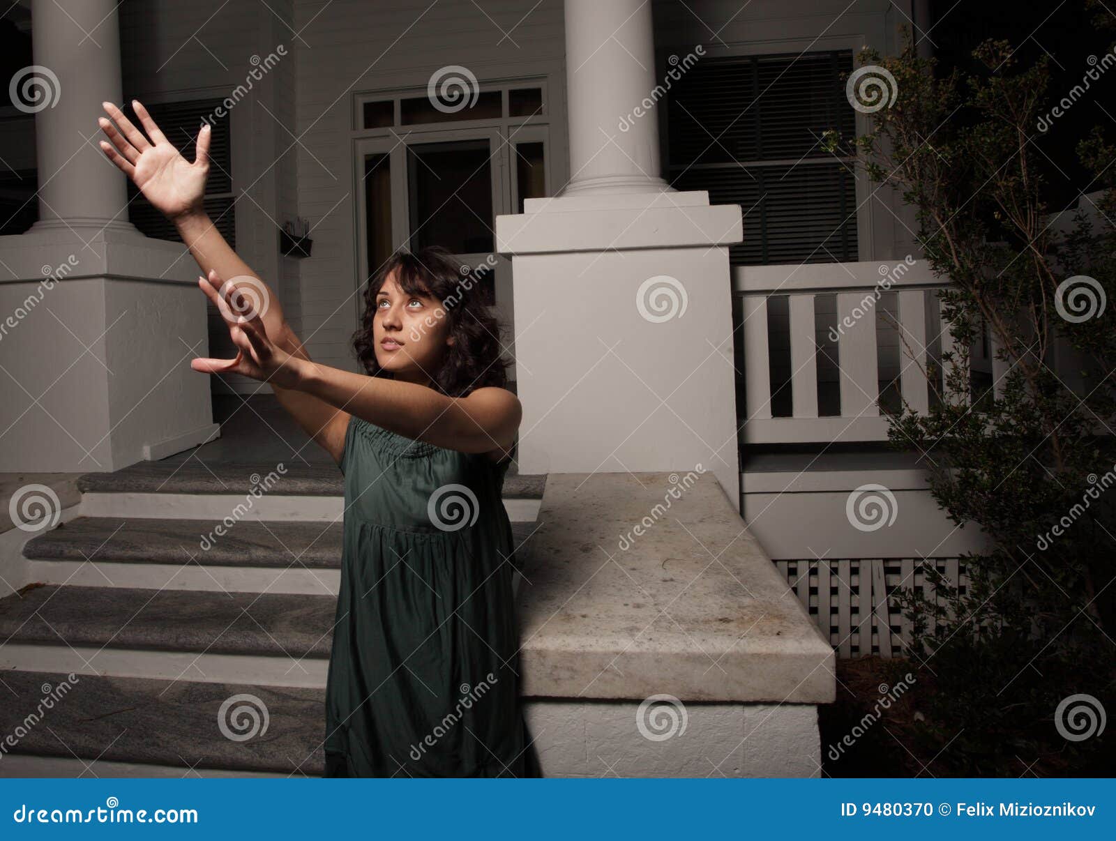 Woman Reaching Towards the Light Stock Photo - Image of hands, strange ...