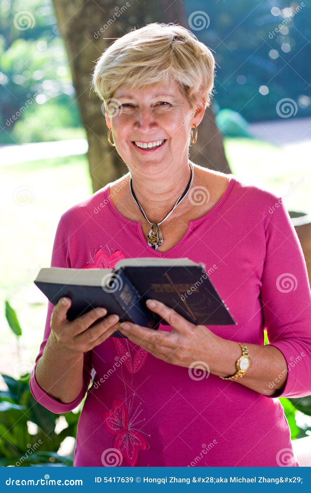 Woman reading bible stock image. Image of hold, blue, enjoy - 5417639