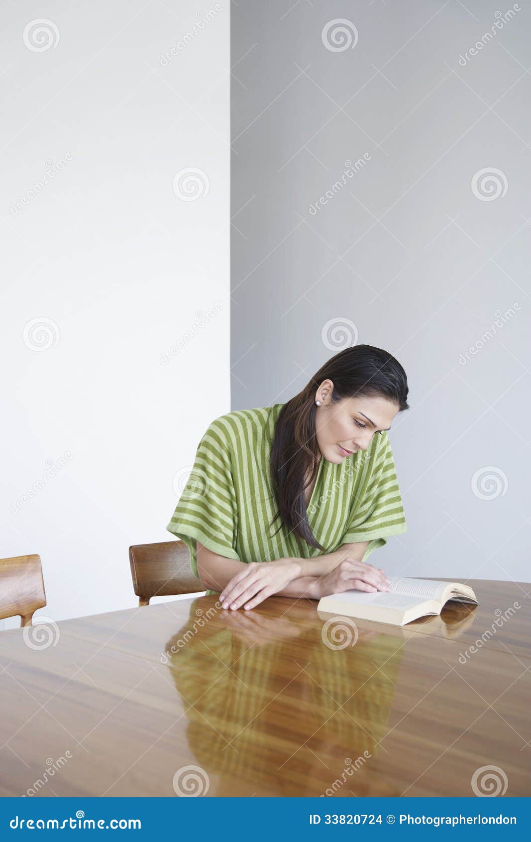 Woman Reading Book at Dining Table Stock Photo - Image of beauty ...