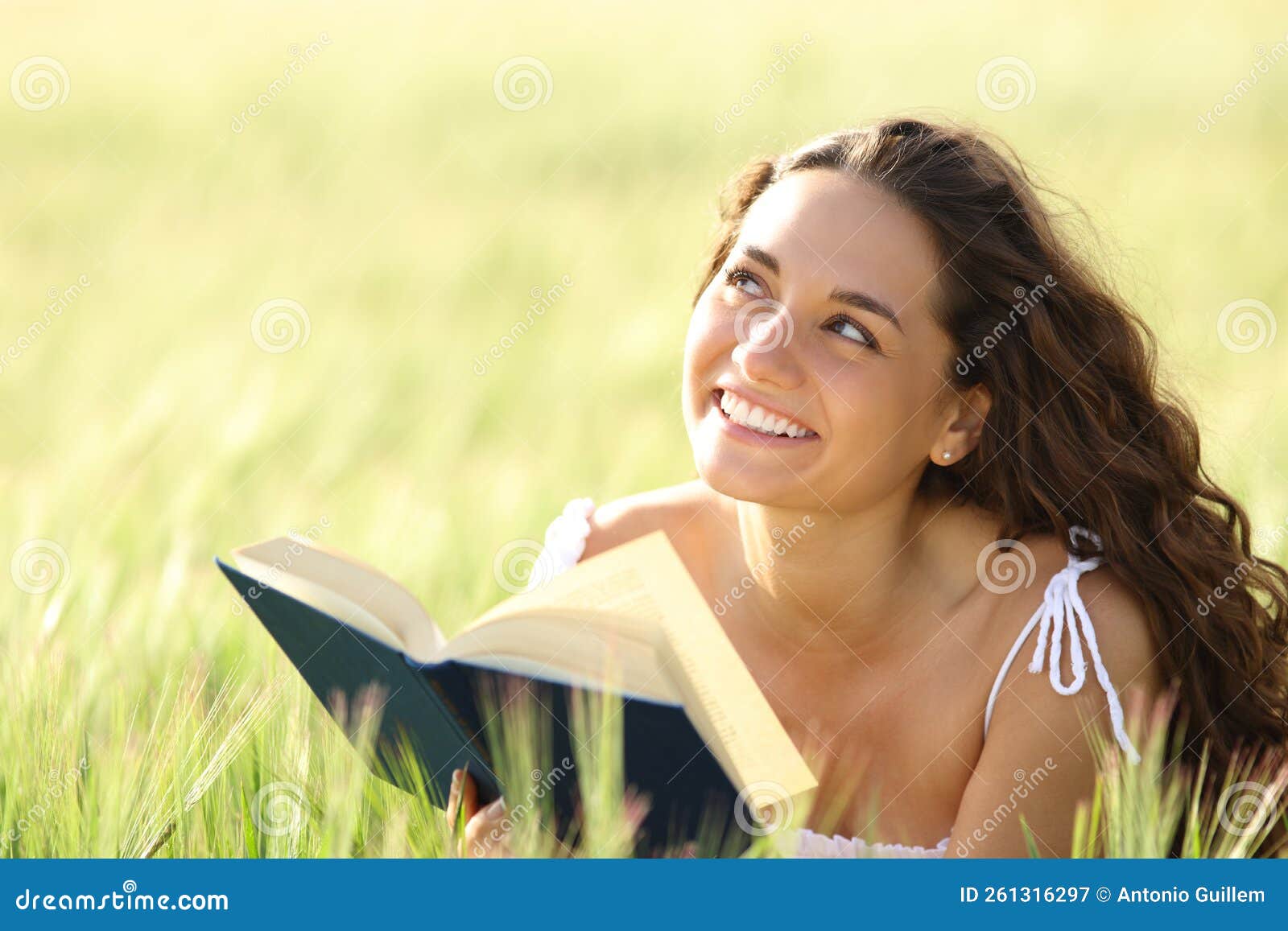 Woman Reading A Book And Dreaming In A Field Stock Image Image Of