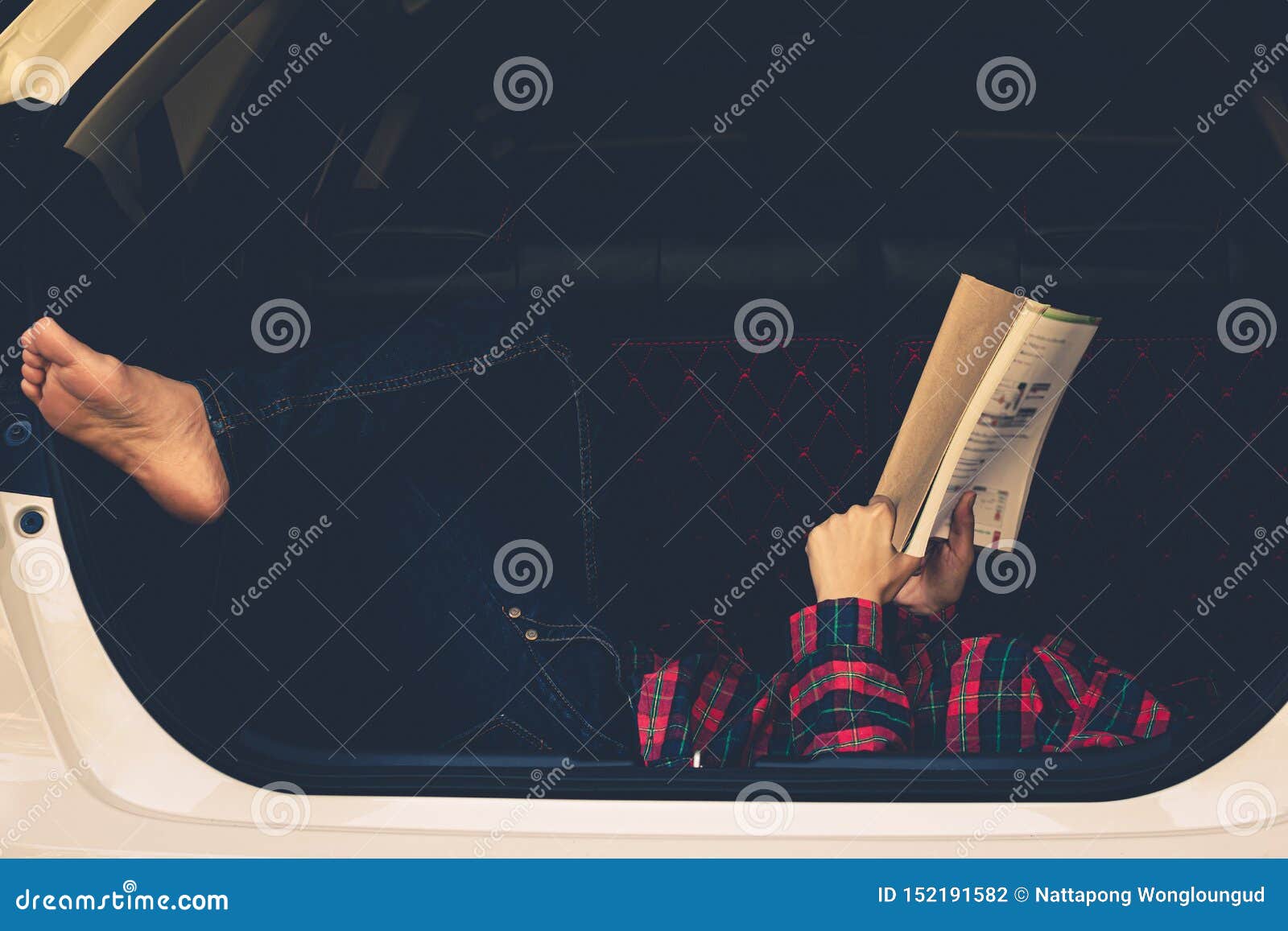 Woman Reading Book in the End of the Car during the Holiday Stock Photo ...