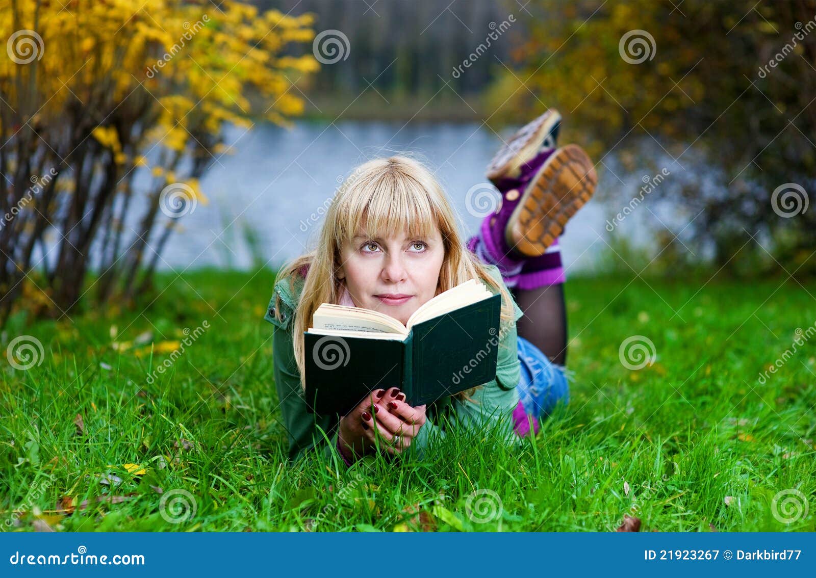 Woman Reading the Book on the Grass Stock Image - Image of smile, park ...