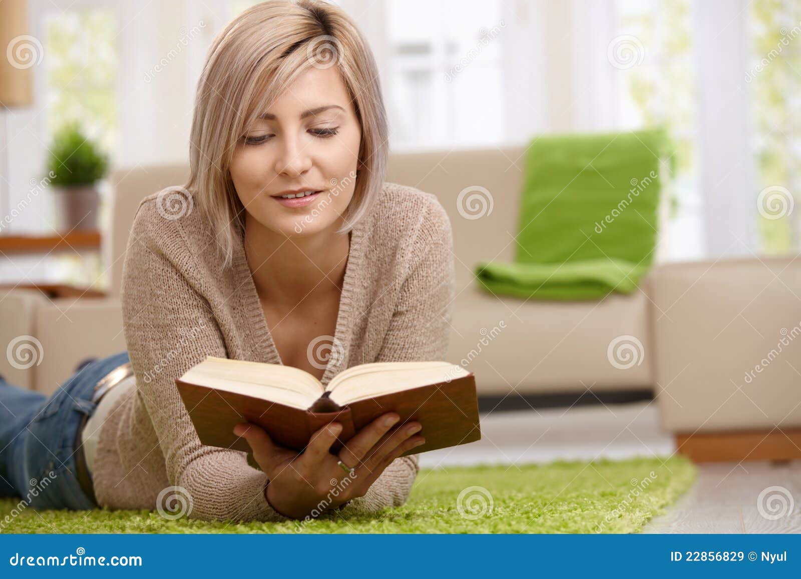 Woman reading book at home stock image. Image of american - 22856829