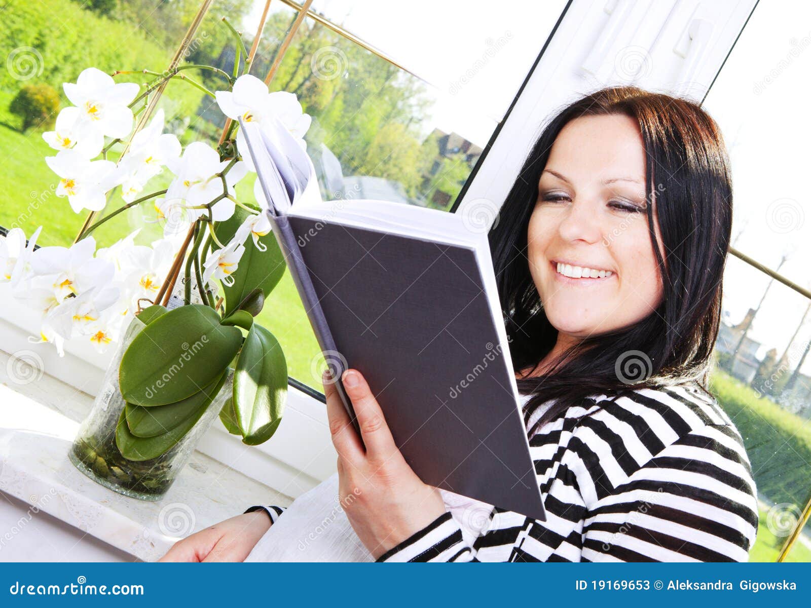 Woman Reading Book in House Stock Image - Image of female, adult: 19169653