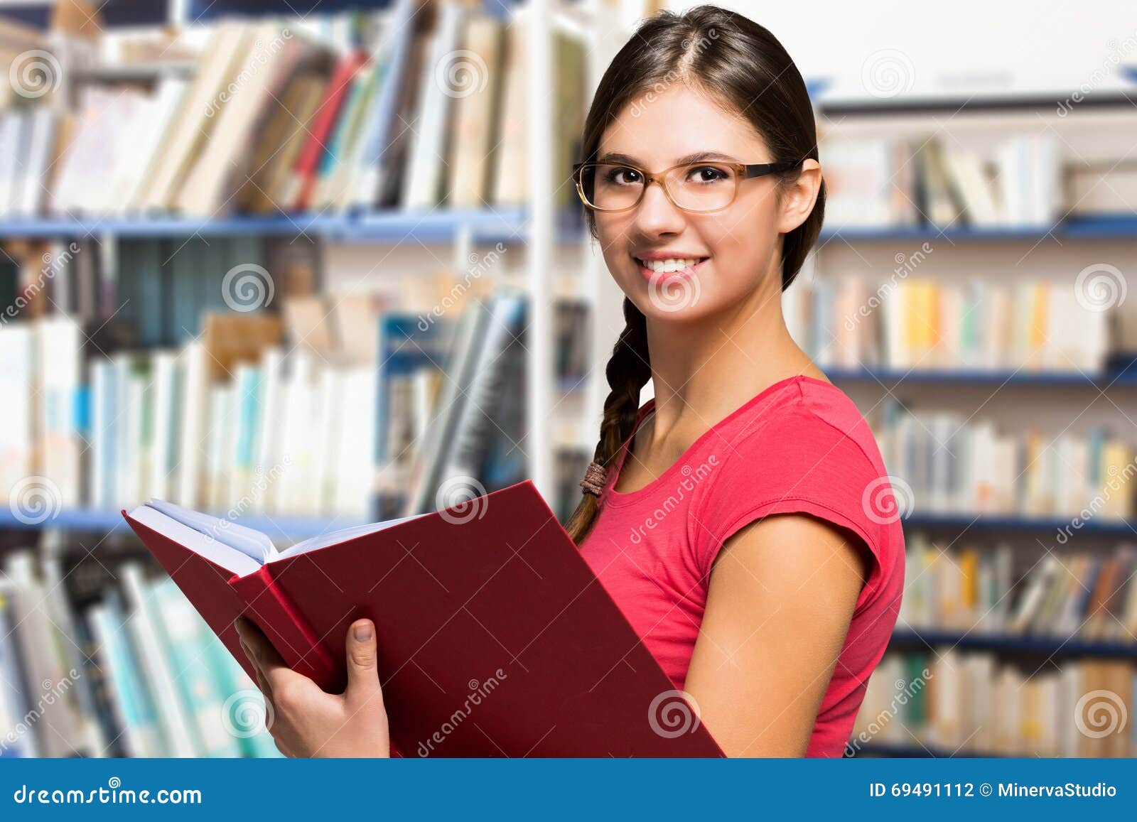 Woman Reading a Book in a Library Stock Photo - Image of student ...