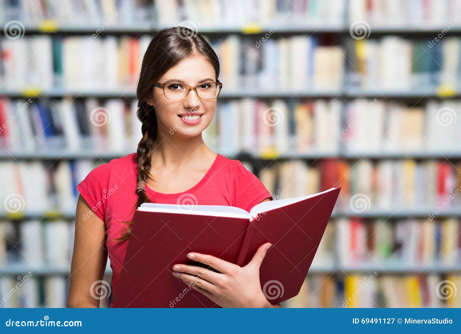 Woman Reading a Book in a Library Stock Image - Image of high, young ...