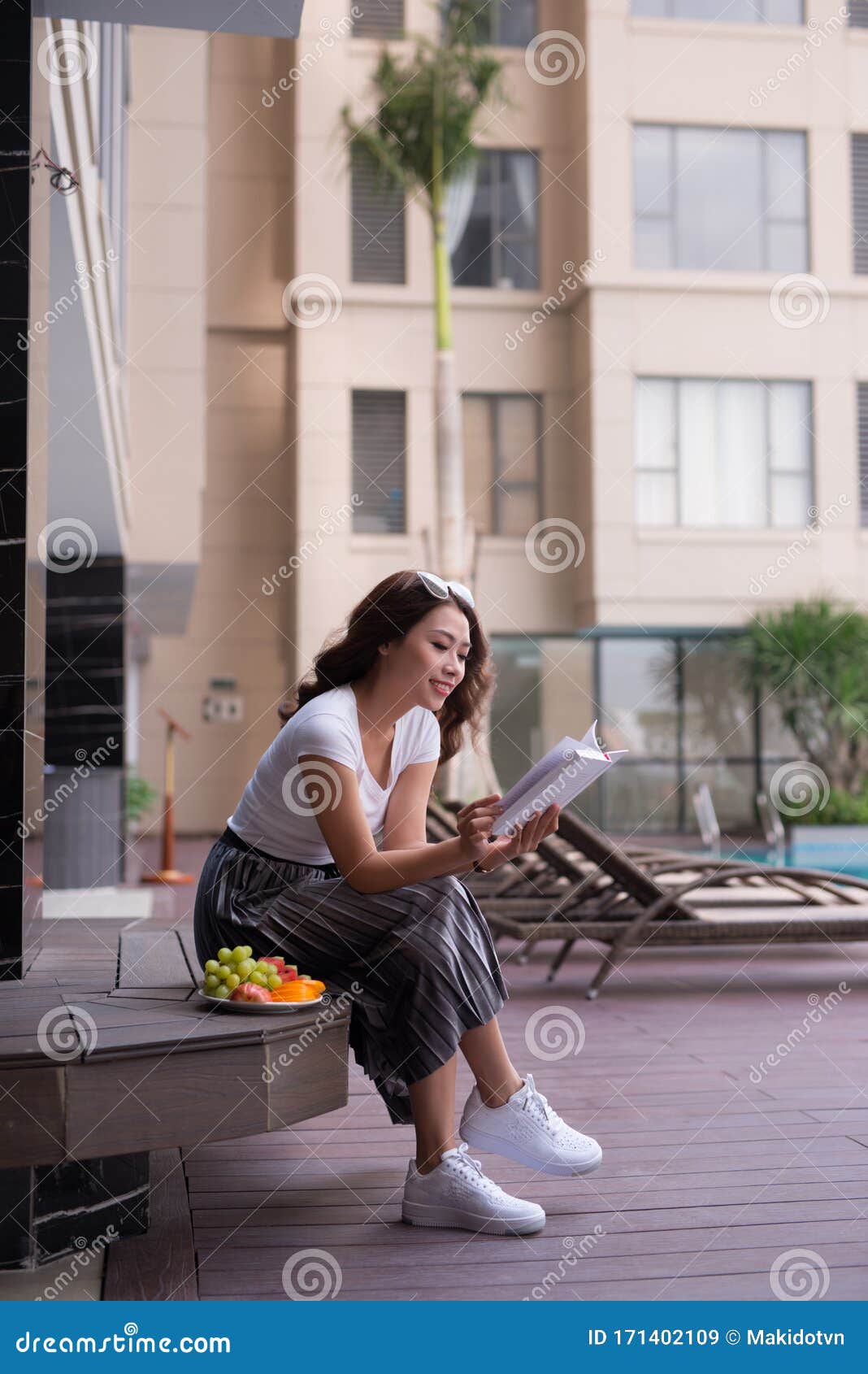 Woman Reading a Book Near the Water Pool Stock Image - Image of chair ...
