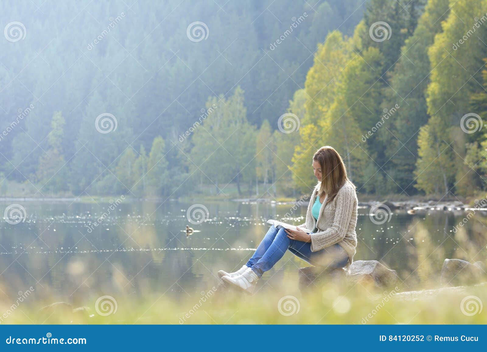 Woman Reading a Book Outdoor Stock Photo - Image of sitting, girl: 84120252