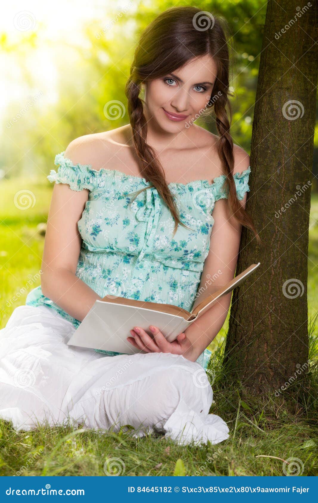 Woman Reading Book Sitting on Grass in Park Stock Photo - Image of ...
