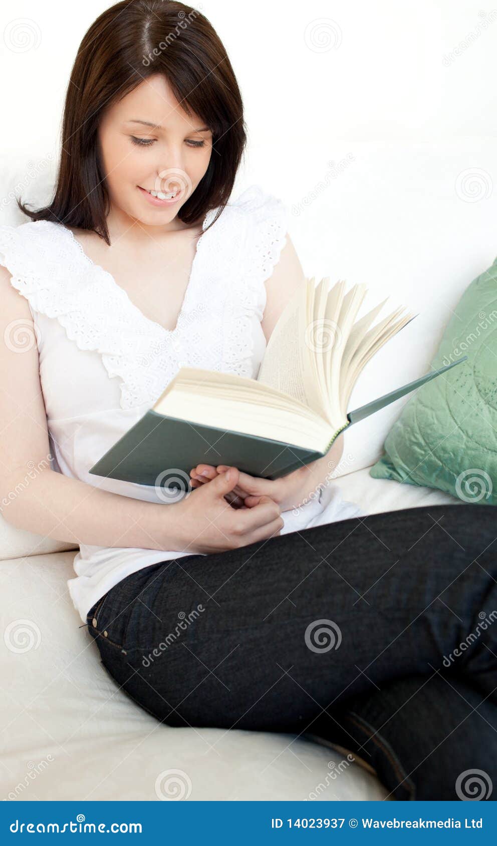 Woman Reading a Book Sitting on a Sofa Stock Image - Image of ...