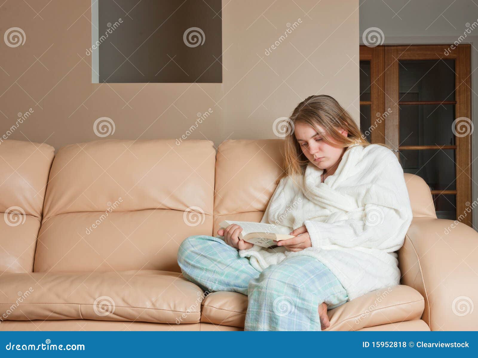 Woman Reading a Book on Sofa Stock Photo - Image of book, young: 15952818