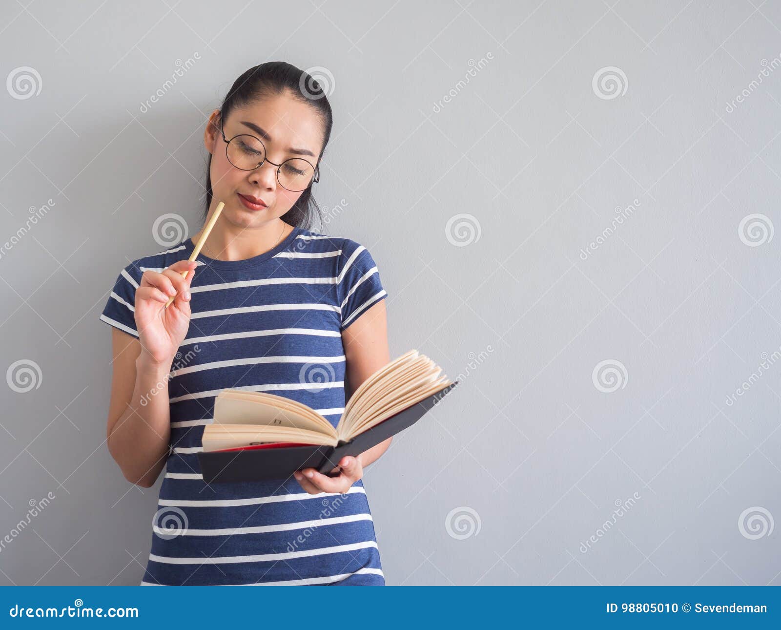 Woman is Reading Book and Think for Ideas. Stock Photo - Image of ...