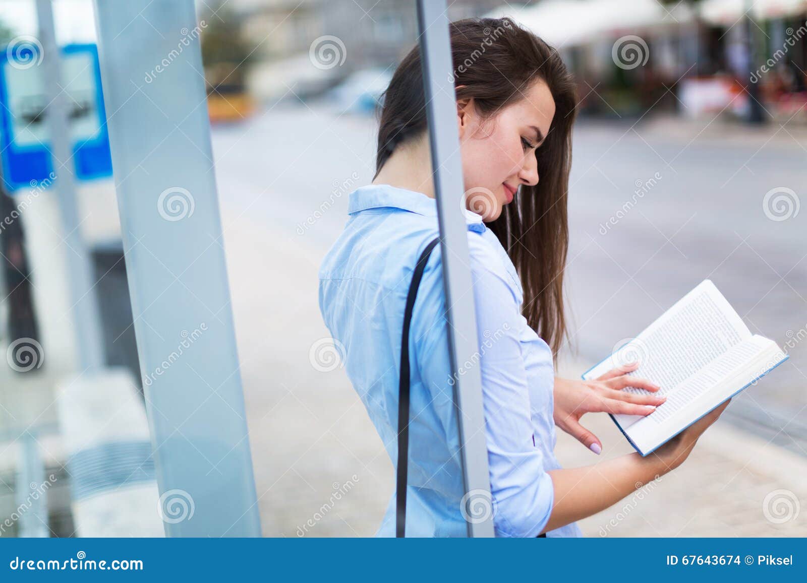 Woman Reading Book while Waiting for Bus Stock Photo - Image of ...