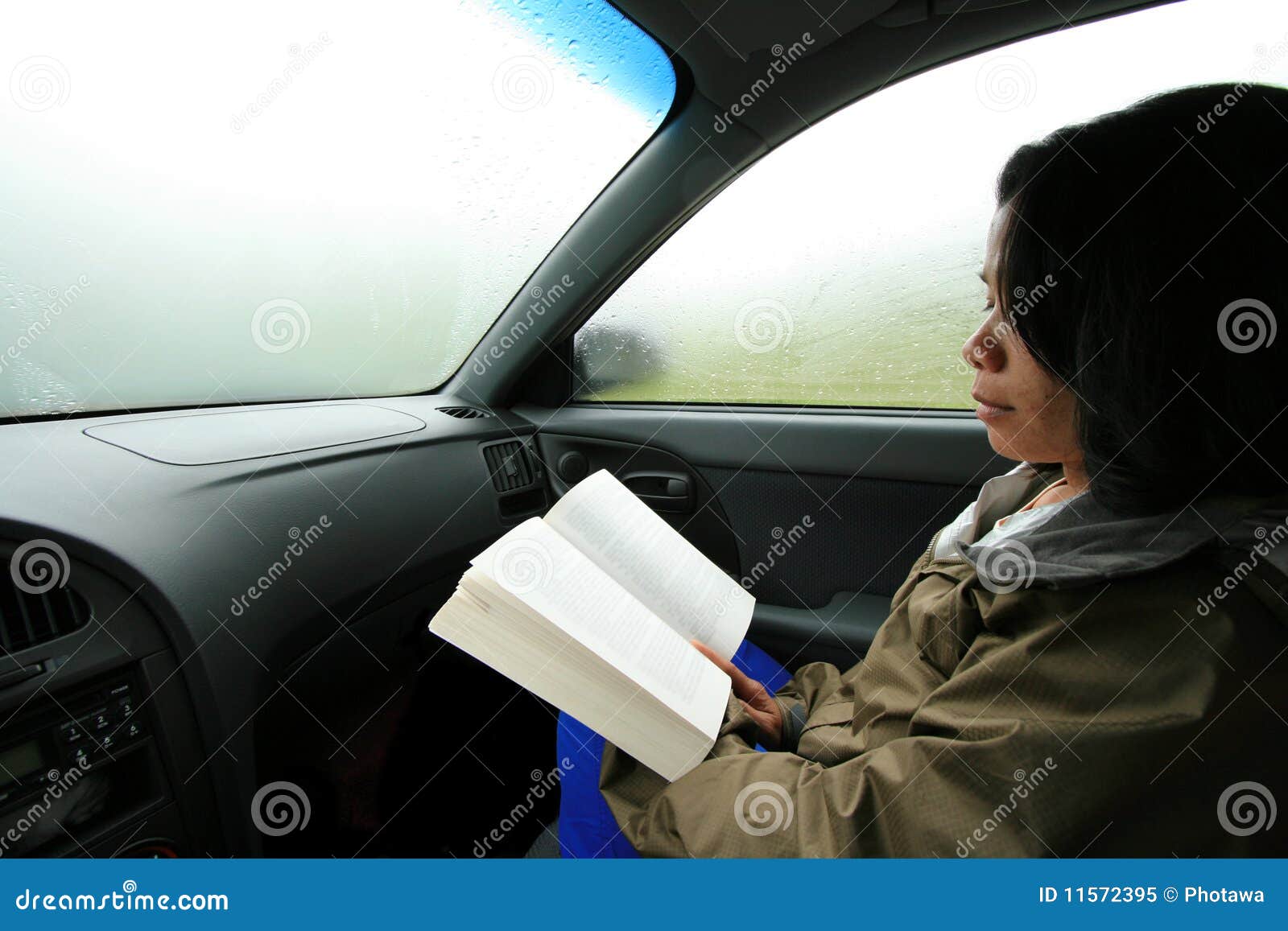 Woman Reading in Car during Rain Stock Image - Image of filipino, woman ...