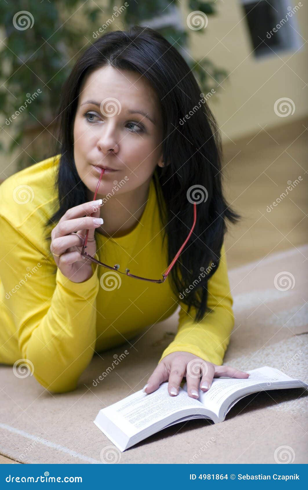 Woman reading on carpet stock photo. Image of learn, book - 4981864