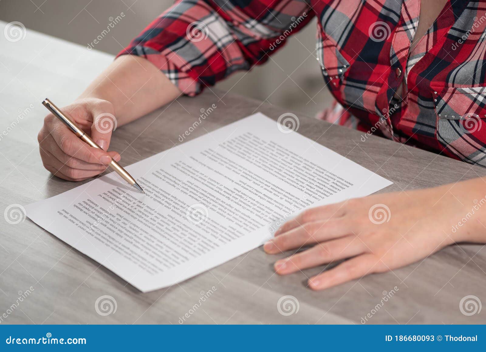 Woman checking a document stock image. Image of sitting - 186680093