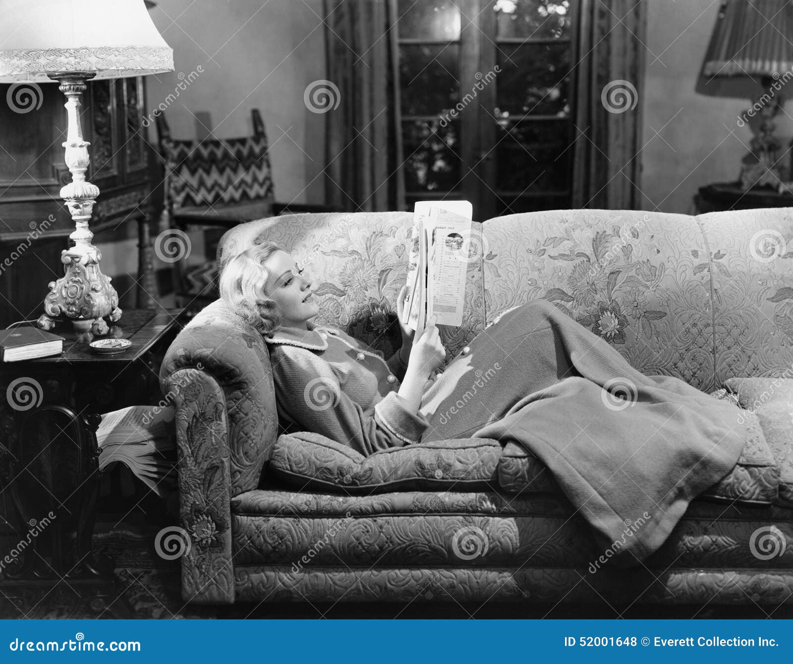 Woman reading on couch stock photo. Image of cheerful - 52001648